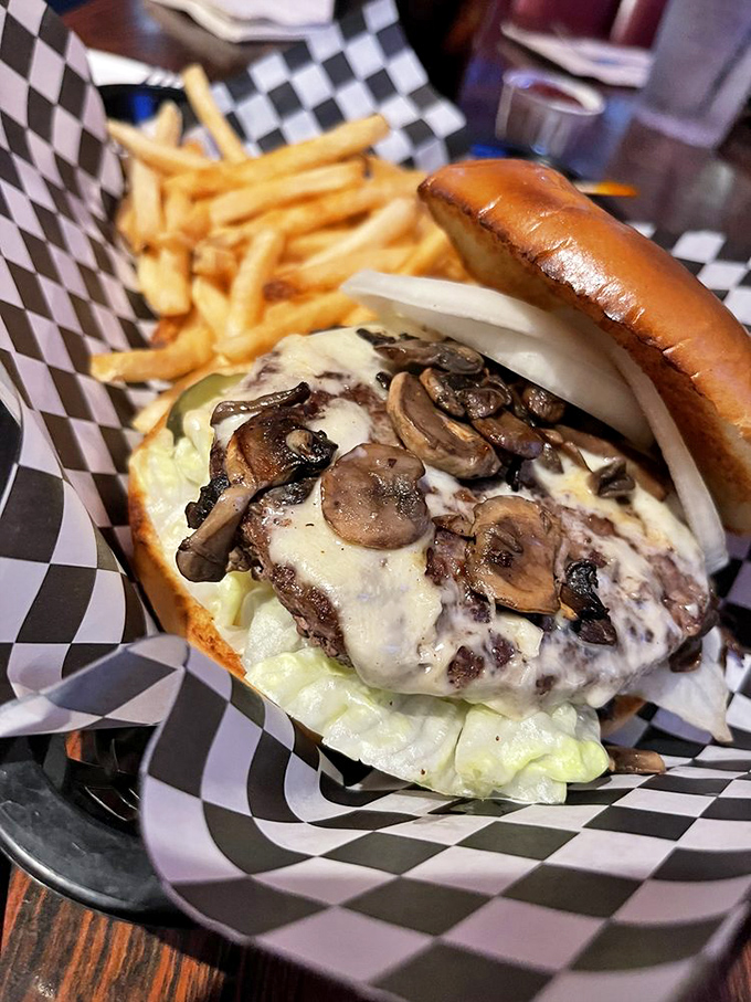 This isn't just a burger – it's a masterpiece of melted cheese and mushrooms that makes fancy $30 versions look like overpriced imposters.