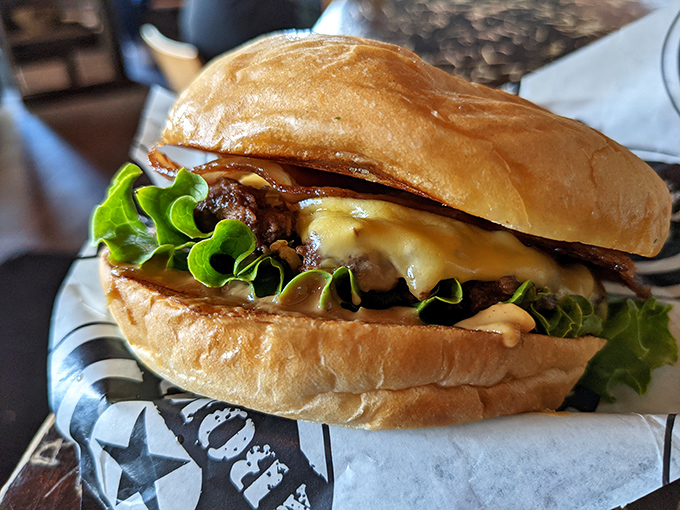 Behold, the burger of your dreams&mdash;where melty cheese cascades over a perfectly seared patty while crisp lettuce stands by, pretending to make it healthy.