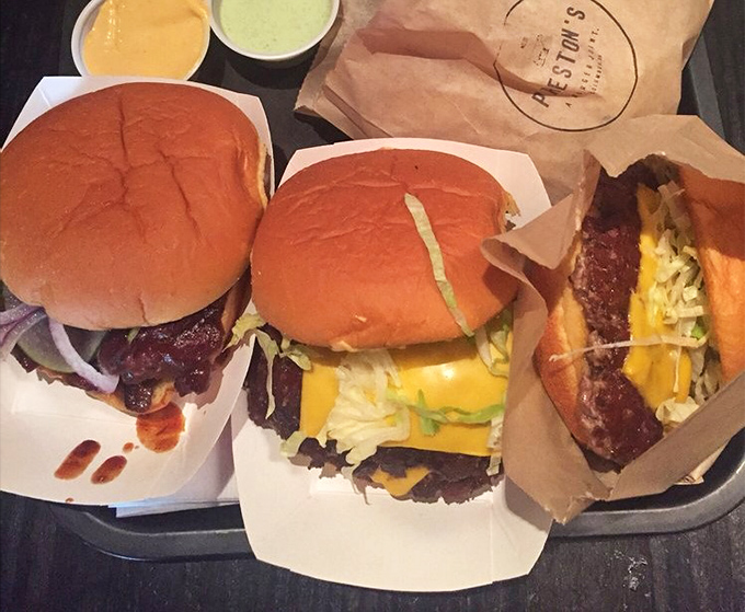 These aren't just burgers; they're edible works of art where melty cheese cascades over perfectly seared patties like a yellow waterfall of happiness.