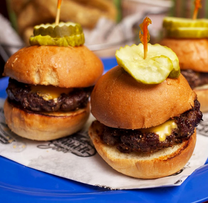 Burger perfection in miniature form! These sliders topped with pickles are like flavor bombs that prove good things come in small packages.