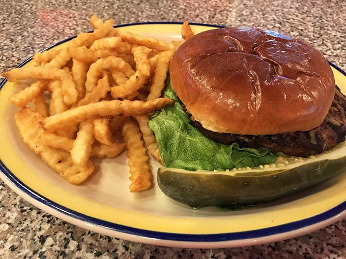 The burger arrives like a masterpiece of simplicity: a perfectly toasted bun, juicy patty, and those golden crinkle-cut fries that crunch with nostalgia.