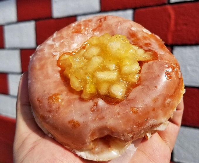 This apple-filled donut isn't just breakfast&mdash;it's edible therapy. The pink glaze and caramelized apple center create a sweet harmony that Mozart would have appreciated.