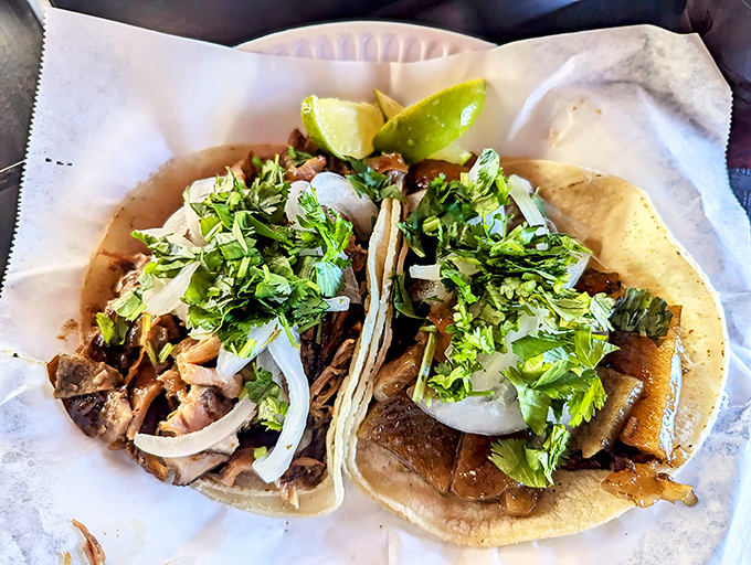 Simplicity perfected: Two tacos adorned with nothing more than cilantro, onion, and lime. When the meat is this good, anything else would just be noise.