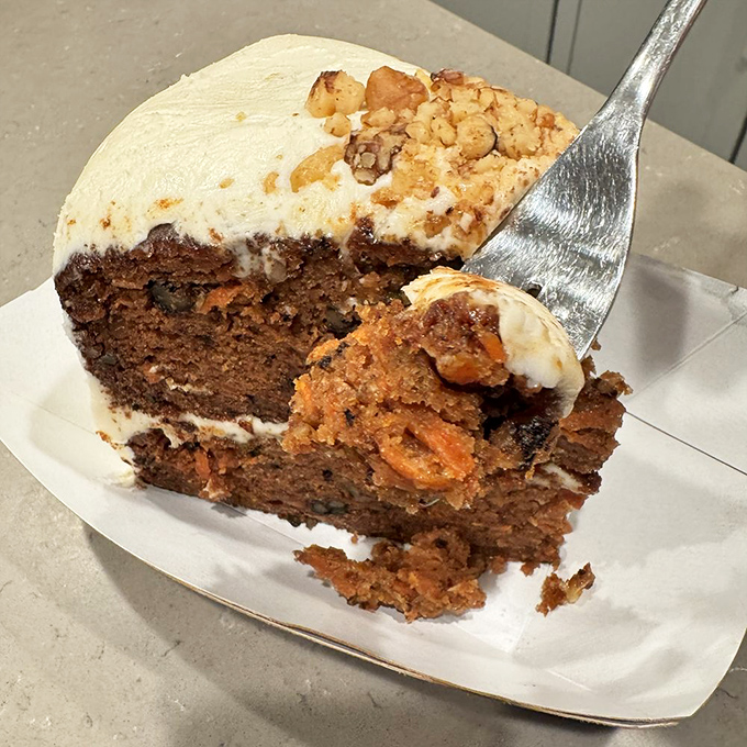Carrot cake that could make a rabbit contemplate grand larceny. Moist, decadent, and worth every calorie-laden forkful.