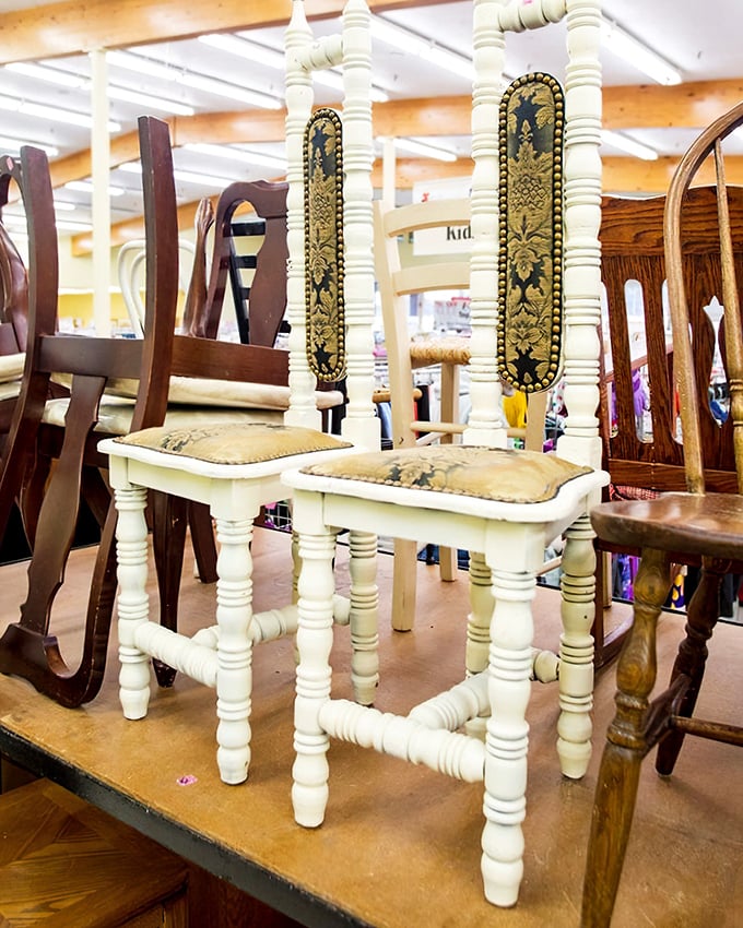 These aren't just chairs&mdash;they're time machines with cushions. That ornate white pair looks like it hosted tea with Victorian royalty in a previous life.