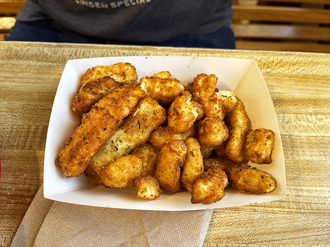 These golden cheese curds aren't just fried—they're transformed into crunchy, molten pockets of joy that would make Wisconsin nervously look over its shoulder.