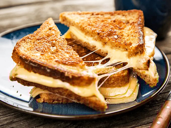 Behold, the grilled cheese of your dreams&mdash;where the cheese pull requires a building permit. Comfort food engineering at its finest.