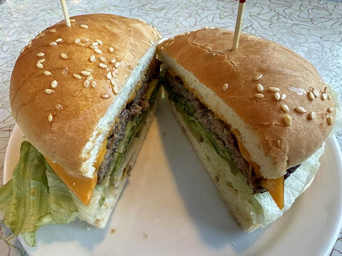 This isn't just a cheeseburger; it's a masterclass in simplicity. The cross-section reveals the perfect meat-to-topping ratio.