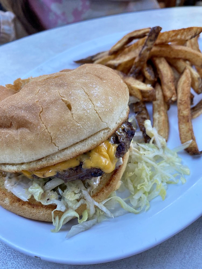 This isn't just a cheeseburger; it's edible poetry on a bun. The melty cheese cascade is what dreams are made of.