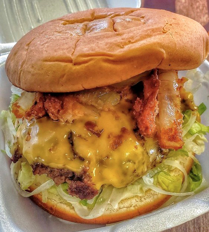 This isn't just a cheeseburger; it's a masterclass in melty perfection. The cheese cascades over the patty like a yellow waterfall of happiness.