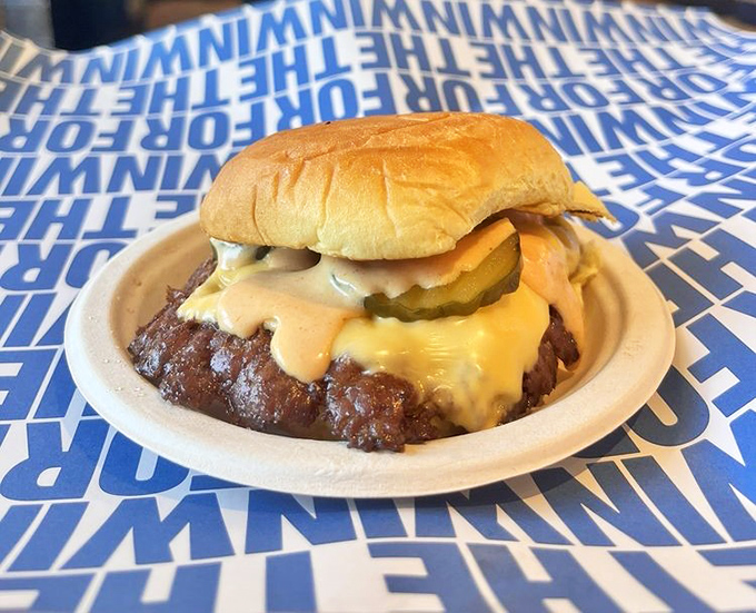 This isn't just a cheeseburger; it's edible poetry on a Martin's potato bun. The melty cheese cascade is what dreams are made of.
