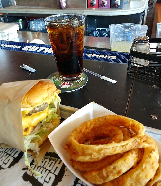 This isn't just a cheeseburger – it's architecture. Notice how the melted cheese cascades perfectly over the patty like a yellow waterfall of joy.