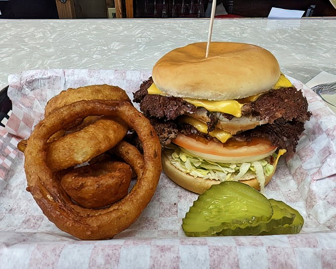 Behold the holy grail of Indiana burgers&mdash;crispy-edged patties with cheese melting between them, a pickle standing guard. Worth every mile of the journey.