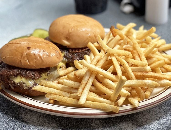 Simple math: Two perfectly seared patties + golden fries = the kind of meal that makes you forget all about your diet plans.