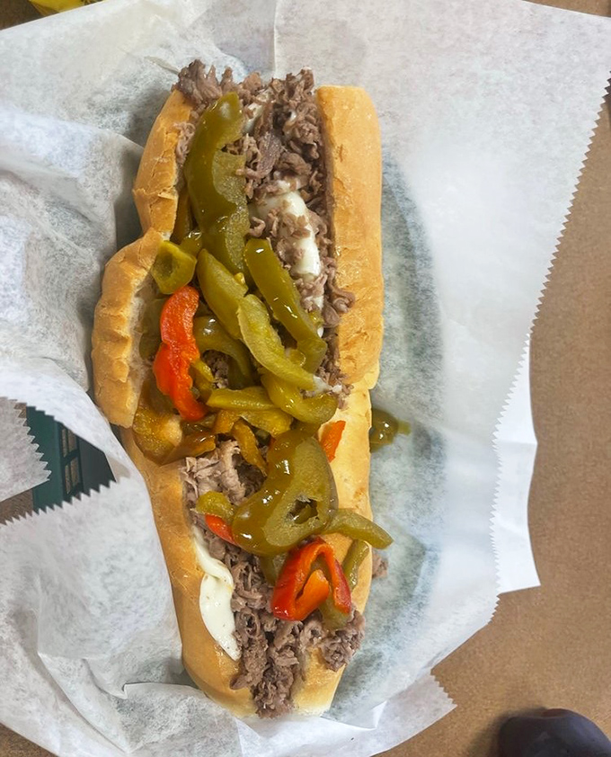 Behold the star of the show&mdash;thinly sliced beef nestled in a perfect roll, crowned with peppers that add both color and kick.