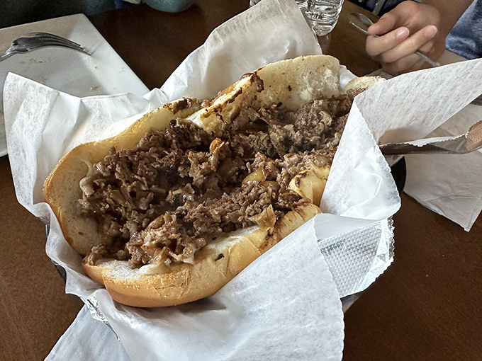 This isn't just a cheesesteak&mdash;it's a masterclass in simplicity. Thinly sliced ribeye nestled in a perfect roll, no passport to Philly required.