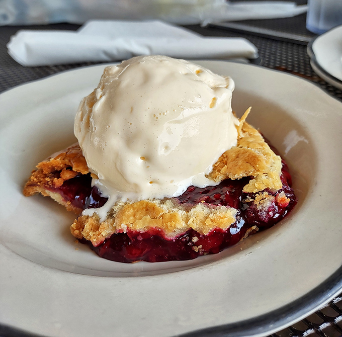 A warm cherry pie à la mode melts into a perfect marriage of tart fruit, flaky crust, and creamy vanilla.