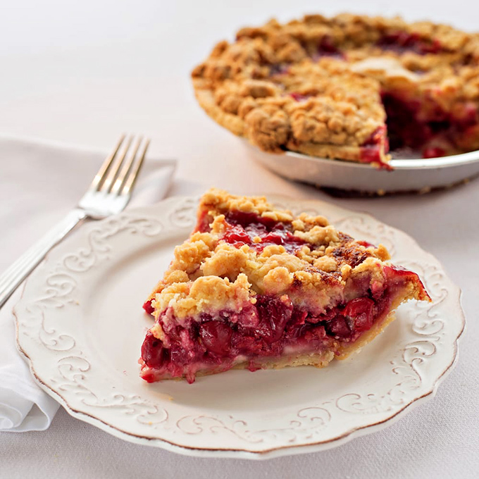 This cherry crumb pie isn't just dessert; it's edible Michigan heritage with a perfect balance of sweet-tart filling and buttery topping.
