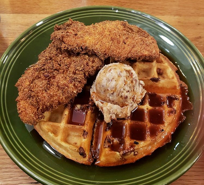 Behold the star attraction: crispy chicken perched atop a golden waffle with butter melting into every perfect square. Breakfast and dinner having their best date ever.