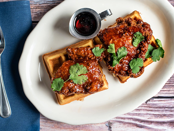 Chicken and waffles: where breakfast and dinner stopped fighting and fell madly in love. That cilantro garnish is just showing off.
