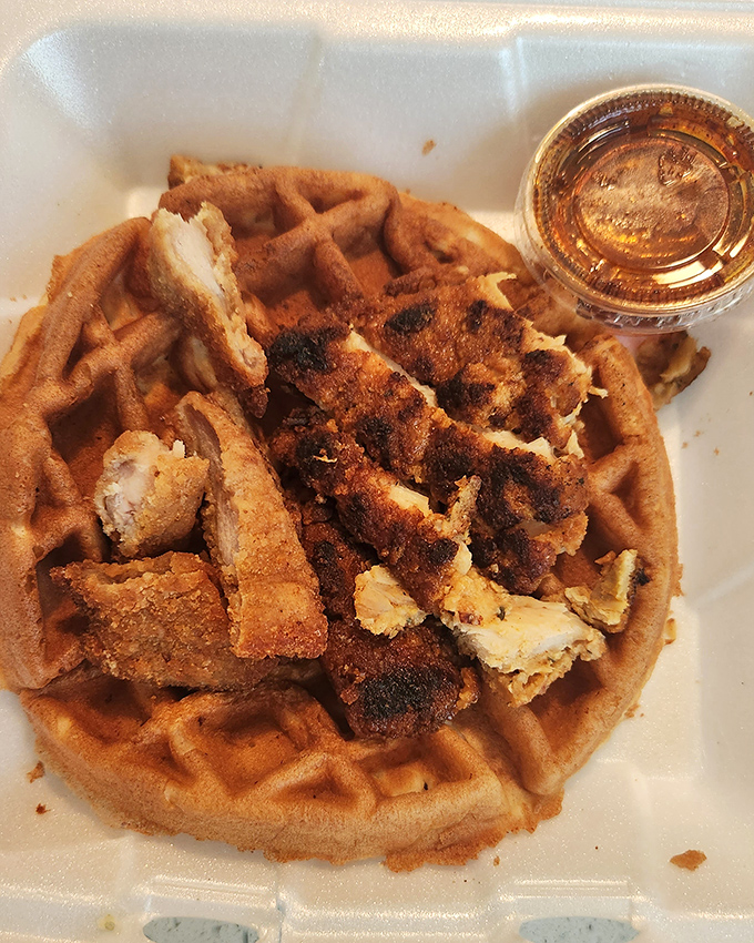 Chicken and waffles: where breakfast and dinner collide in perfect harmony. That golden waffle cradles crispy chicken like they were made for each other.