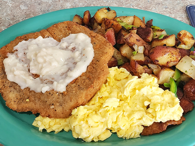 Behold the star attraction: chicken fried steak with country gravy that could make a vegetarian question their life choices, served with eggs and potatoes.