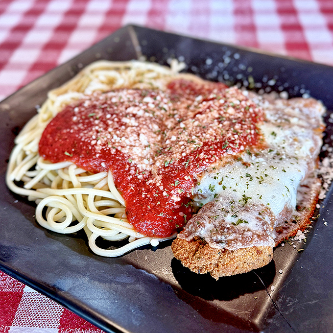 Behold, the crown jewel: chicken parmesan that makes you question why you'd ever order anything else. That cheese pull deserves its own zip code.