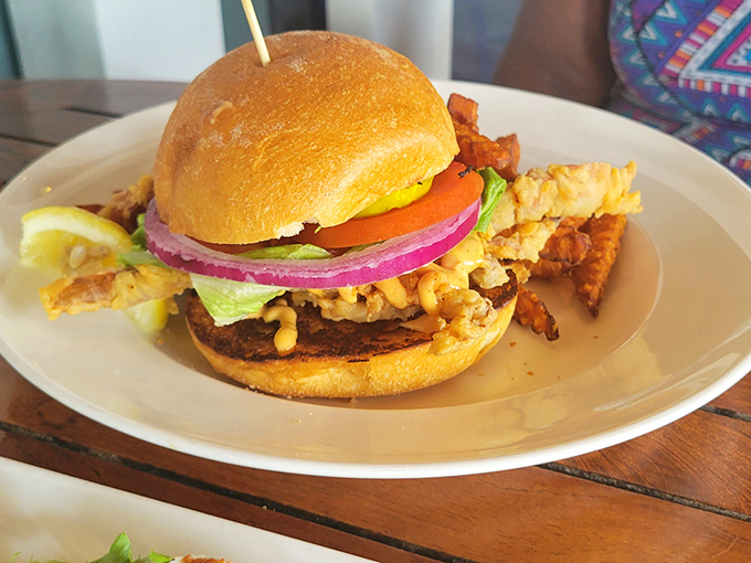 The star of the show arrives! This isn't just a chicken sandwich&mdash;it's an architectural masterpiece of crispy goodness, fresh veggies, and that mysteriously addictive sauce.