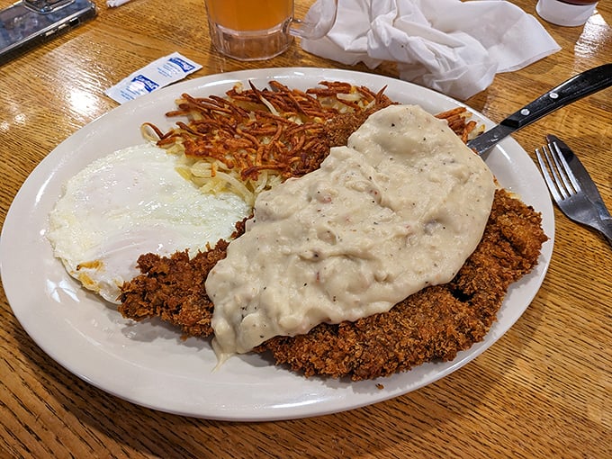 Country fried steak that could make a vegetarian weep with temptation, smothered in gravy that should have its own fan club.