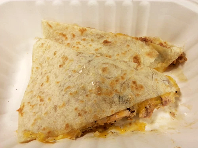 Quesadilla perfection that would make abuelitas nod in approval. Crispy exterior, melty interior &ndash; the universal language of comfort food.