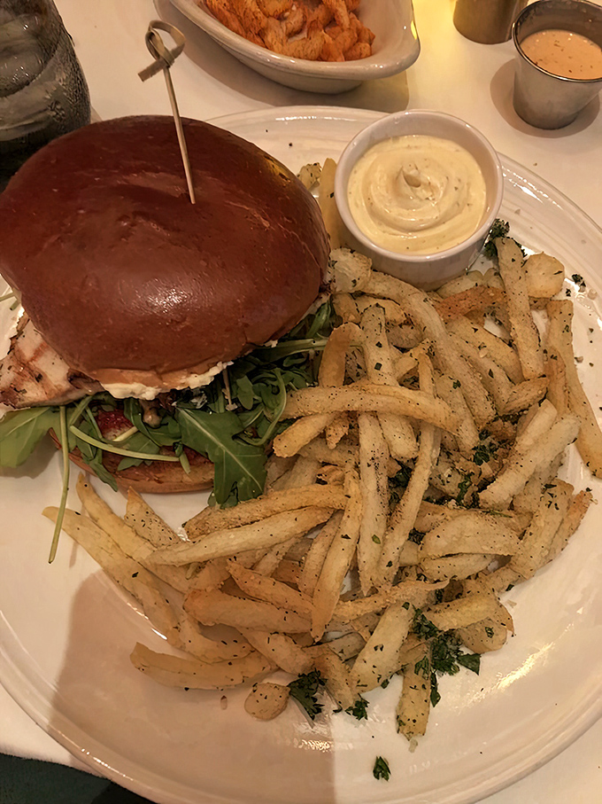 Not all heroes wear capes &ndash; some come on brioche buns. This chicken sandwich with its perfectly golden exterior and mountain of crispy fries demands respect and napkins.