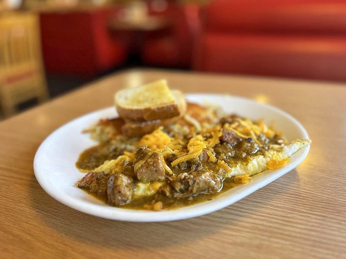 The Chile Relleno Omelette arrives like a savory treasure chest &ndash; eggs and cheese embracing chunks of meat in a pool of rich sauce that demands to be sopped up.