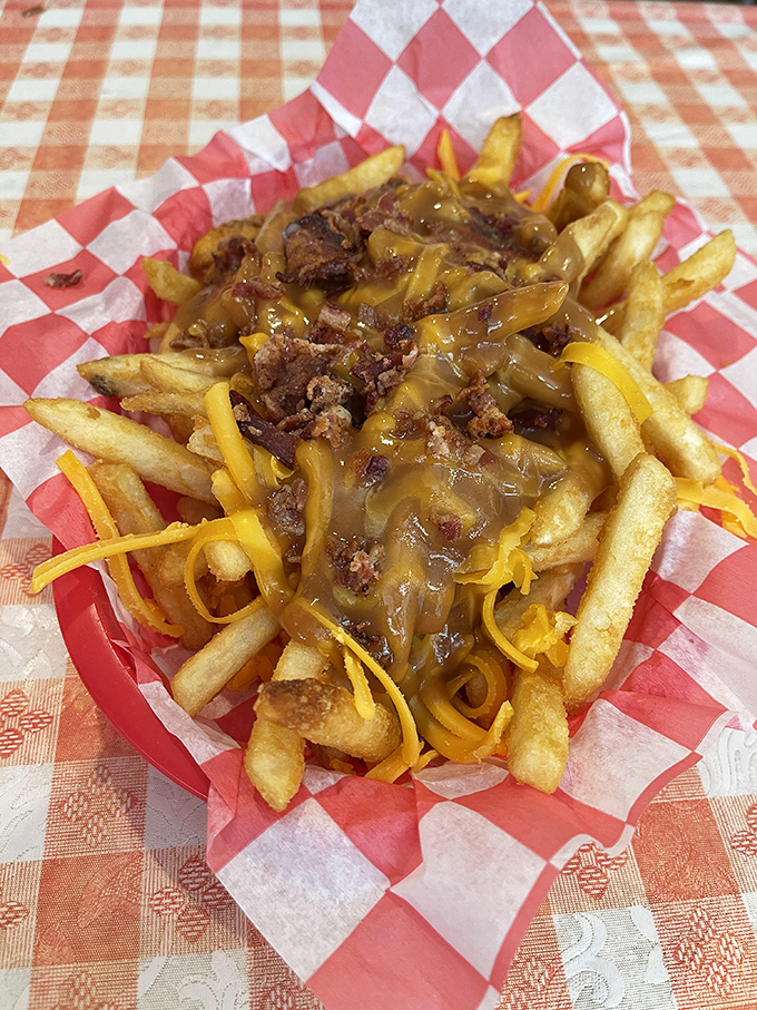 These chili cheese fries aren't just a side&mdash;they're a commitment to happiness, served in a red basket that says "diet starts tomorrow."