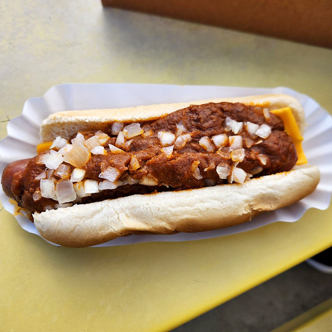 This isn't just a chili dog&mdash;it's a masterclass in simplicity, where every diced onion piece plays a crucial supporting role.