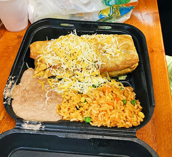 This isn't just a chimichanga&mdash;it's a golden-brown fortress of flavor, accompanied by perfectly seasoned rice that refuses to be mere sidekick status.
