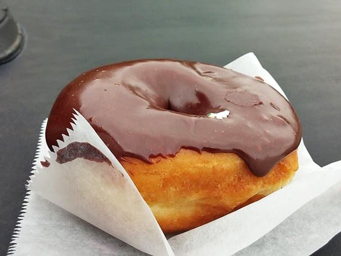 This chocolate-glazed masterpiece isn't trying to be Instagram-famous; it's too busy being what every other chocolate donut wishes it could be.