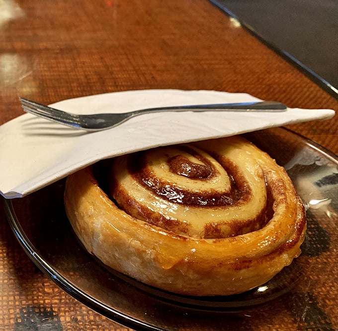 This cinnamon roll isn't just breakfast; it's an edible hug that makes Monday mornings slightly less criminal. The glaze alone deserves its own fan club.