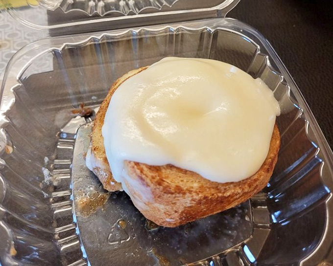 This isn't just a cinnamon roll; it's what clouds must taste like if they were made of butter, cinnamon, and childhood memories.