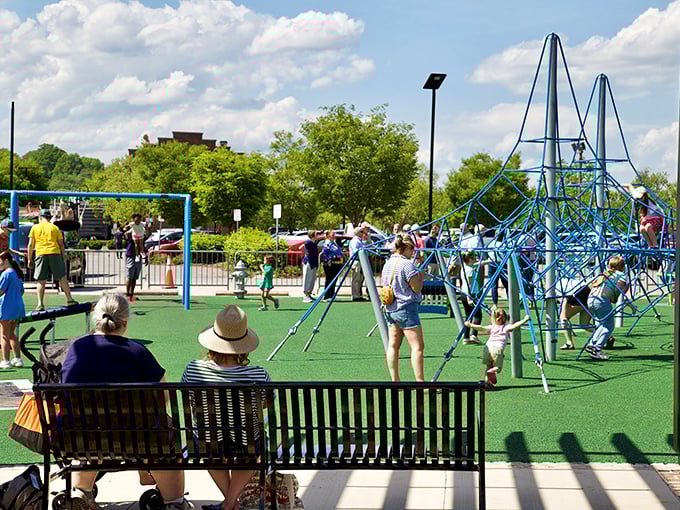 Playground paradise where grandparents can rest their knees while watching the next generation master the art of climbing.