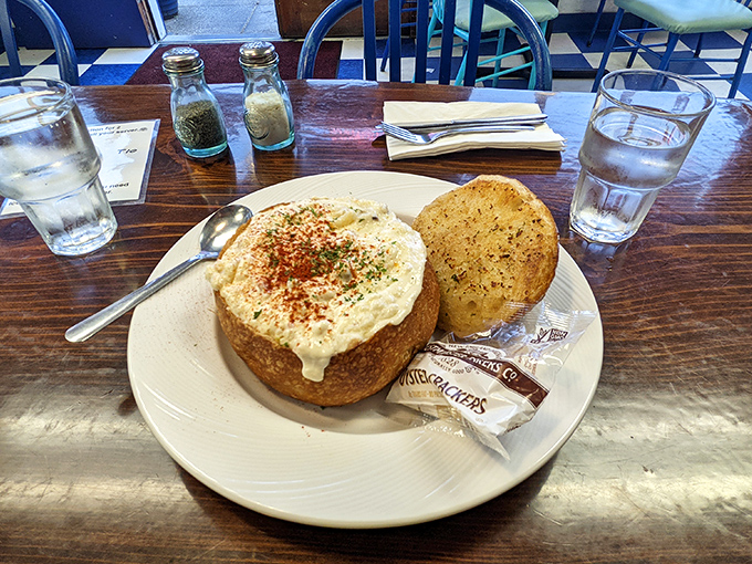 Bread bowls: where architecture meets comfort food. This chowder fortress, dusted with paprika, is the edible equivalent of a warm coastal hug.
