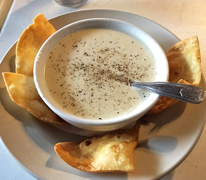 Creamy clam chowder that demands to be savored slowly. Those crispy tortilla chips aren't just garnish&mdash;they're essential dipping instruments for maximum enjoyment.