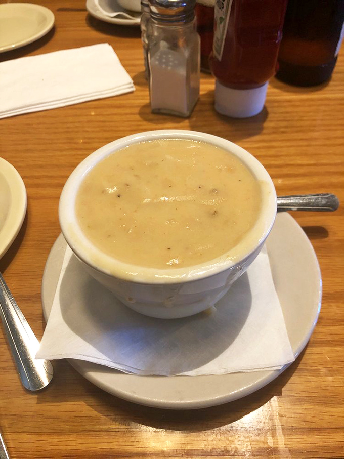 The legendary clam chowder arrives like a creamy cloud from heaven, making you wonder if mermaids moonlight as chefs.