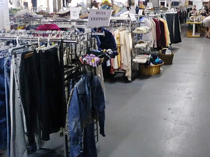 The clothing section isn't just organized—it's curated, with decades of fashion history hanging side by side in a textile time machine.