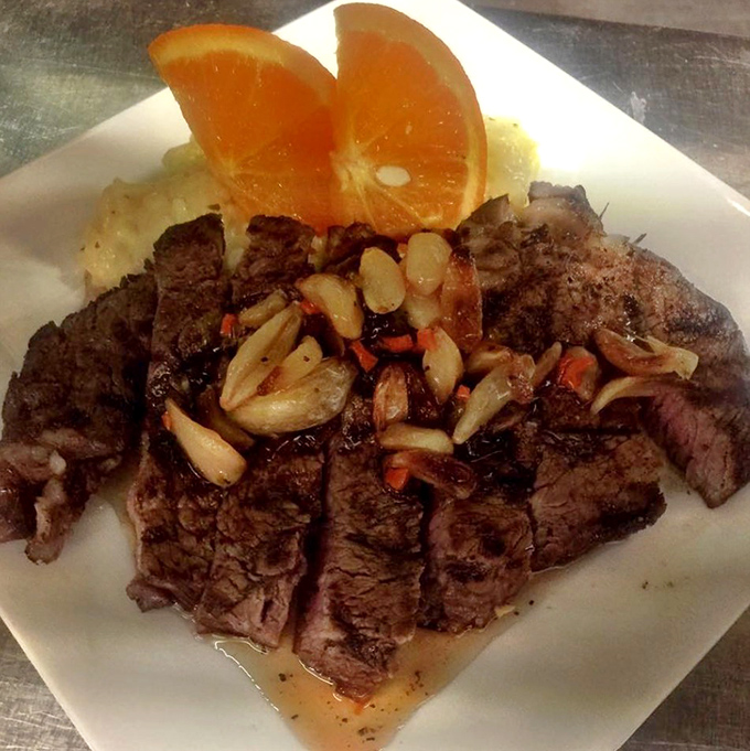 This cold smoked ribeye doesn't just sit on the plate&mdash;it commands attention with its perfect sear and aromatic caramelized onions.