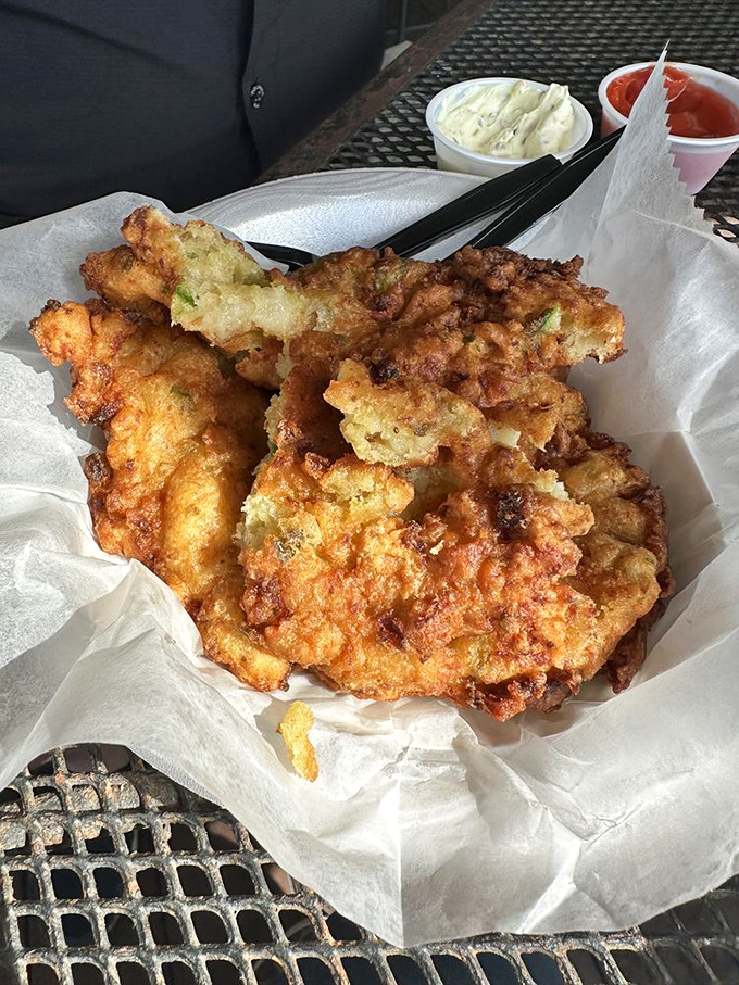 The legendary conch fritters arrive like golden orbs of happiness, crispy outside and tender within. Worth driving across state lines for these beauties.