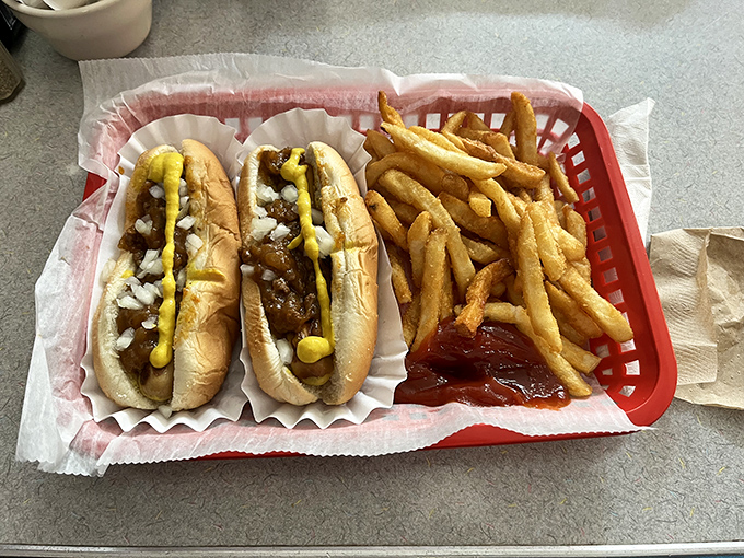 Two perfect coneys, dressed with that secret-recipe meat sauce, mustard, and onions. Like a culinary time machine that transports you back to simpler times.