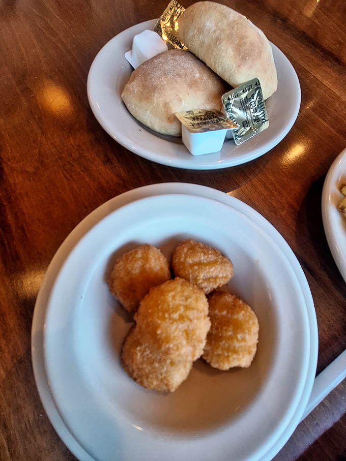 Golden corn nuggets arrive like little treasures &ndash; crispy outside, sweet and tender inside &ndash; paired with fresh-baked rolls that demand butter's attention.