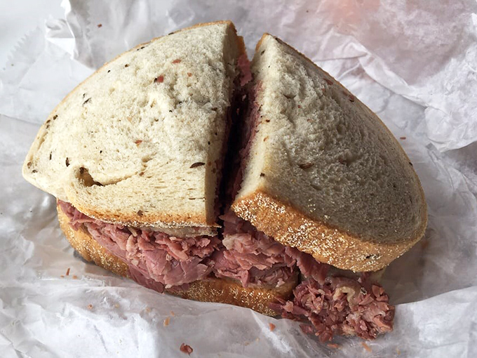 This isn't just a sandwich; it's a monument to proper meat-to-bread ratio that would make any New Yorker nod in approval.