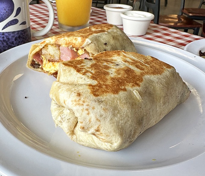 Breakfast burritos: where eggs, bacon, and cheese find their higher purpose. This handheld masterpiece proves tortillas were invented for morning meals.