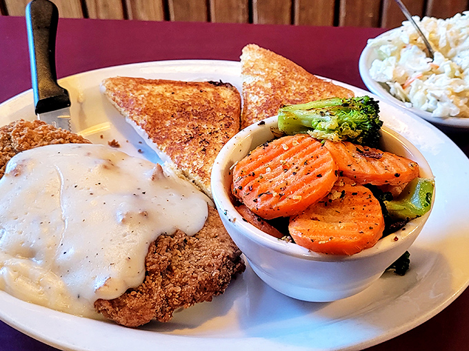 Country fried steak that doesn't need a passport to transport you straight to comfort food nirvana, complete with gravy that hugs every bite.